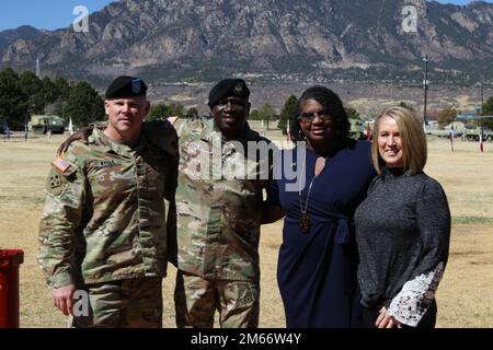 Col. Damon Wells, commander of 4th Infantry Division Artillery, hands over the battalion colors ...