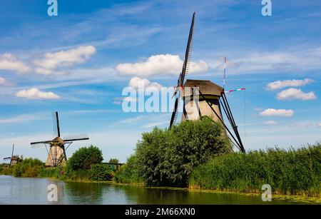 Windmills along waterside in Kinderdijk Stock Photo - Alamy