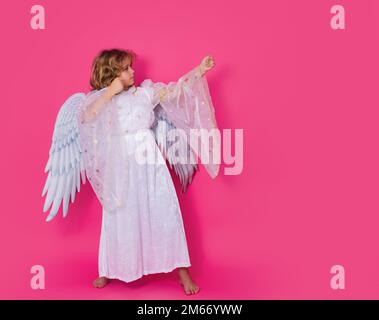 Excited little angel, amazed kids. Kid wearing angel costume white ...