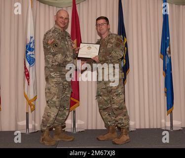 Col. Jon Brierton (center), commander of U.S. Army Support Activity ...