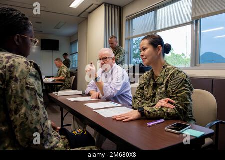 US Navy U.S. Navy Career Counselor 1st Class helps construct a wheel ...
