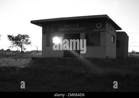 shadows at sunset in African village on a late summer depicting slow ...