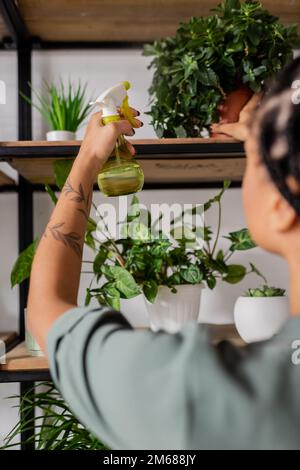 Cropped view of african american proprietor scanning box with shipping ...