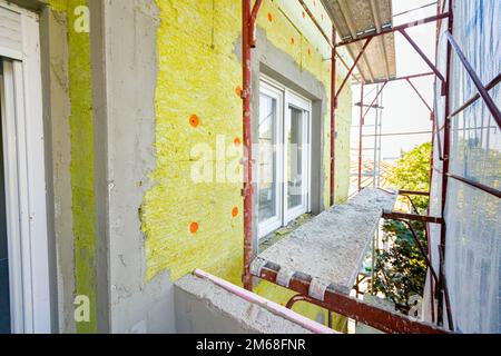 Applied thermal isolation stone wool on the brick wall of residential ...