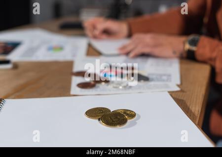 Selective focus of November 2022 desk calendar on blue background with ...