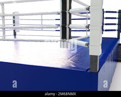 A modern regulation sized boxing ring with opposing blue and red ...