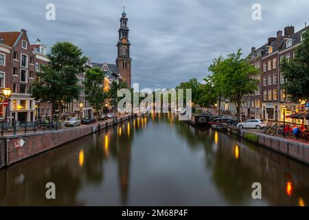 evening view on prinsengracht in amsterdam with westkerk lanterns ...