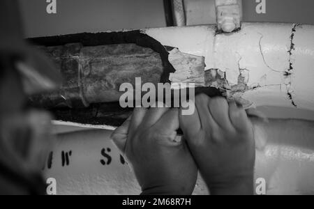 YOKOSUKA, Japan (April 19, 2022) – Discarded pieces of deteriorated ...