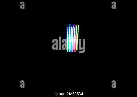 Beautiful light painting designs on dark black background. Long ...