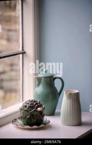 Pottery on a window sill Stock Photo - Alamy