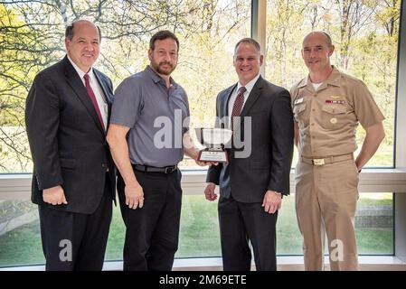 NAVAIR Deputy Commander Tom Rudowsky presents Cmdr. Dan Hutton, PMA-290 sustainment co-lead ...