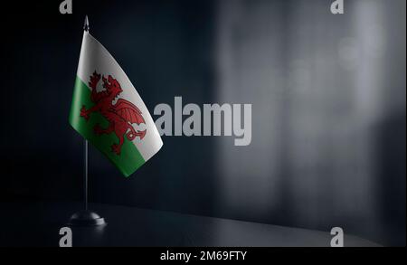 Small national flag of the Wales on a black background Stock Photo - Alamy