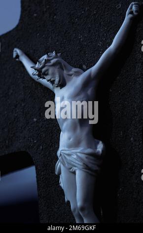 A crucified Black Jesus Christ statue stands in a brick grotto at the Bantay Church in Ilocos ...