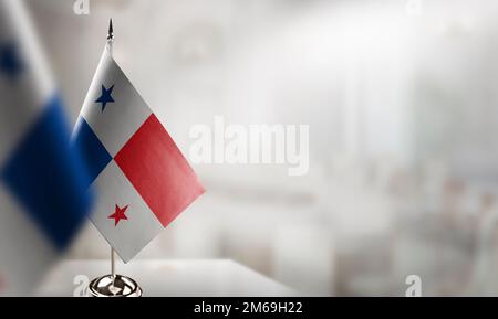Small flags of the Panama on an abstract blurry background Stock Photo ...