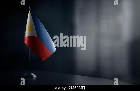 Small flags of the Philippines on an abstract blurry background Stock ...