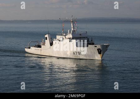 The French naval survey ship FS LAPEROUSE (A791) moves slowly towards a berth in the Naval Base ...