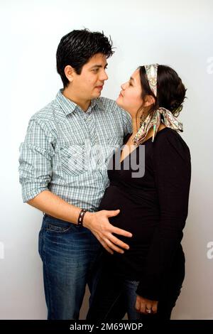 Parents expecting a baby. Father holds the belly of the mother and ...