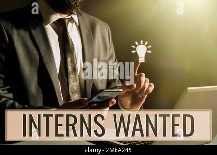 Handwriting text Interns Wanted, Concept meaning Looking for on the job ...