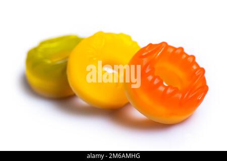 Multicolored jelly candy donuts on a white background Stock Photo - Alamy