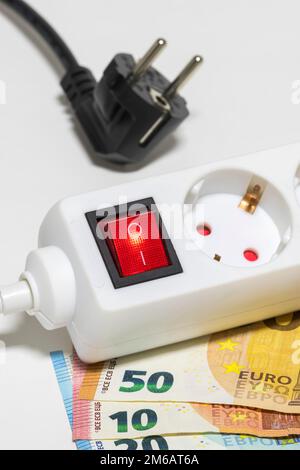Switchable power outlet strip strip, euro banknote, symbol energy costs ...