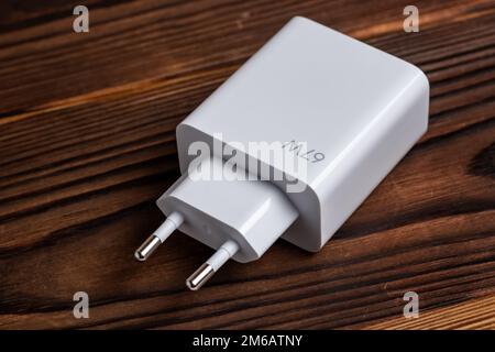 White charger power 76 W on white background Stock Photo - Alamy