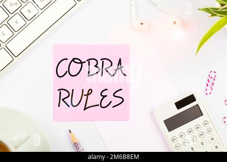 Hand writing sign Cobra Rules. Internet Concept gives workers who lose ...
