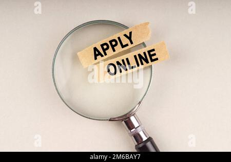 On the magnifying glass are paper strips with the inscription - MAKE ...