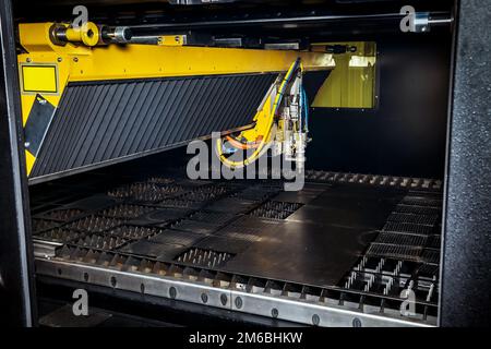 Machine for constant metal laser cutting, metal processing close up ...