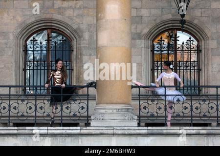 Two beautiful ballerinas dancing together around a column Stock Photo ...