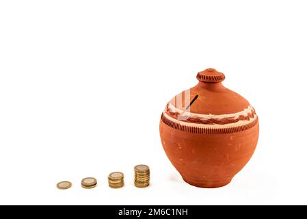 Clay pot jug money box, penny or piggy bank. Top view coins and Clay ...