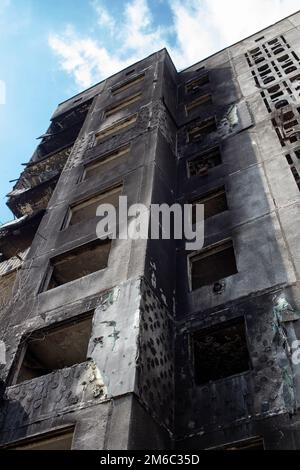 Russian bomb hit civilian buildings. War in Ukraine, ruined building ...