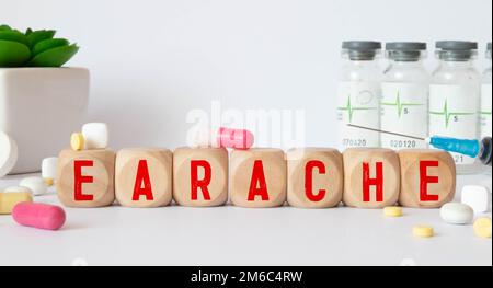 Earache, word cube with background Stock Photo - Alamy