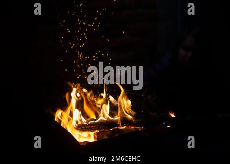 Flames of pyre. Fire in dark. Burning firewood. Details of night ...