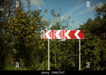Sharp turn of road. Sharp turn sign. Highway infrastructure. Red road ...