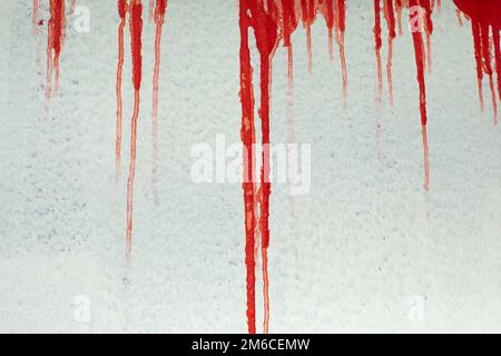 Red paint flows down wall. Graffiti details. Smudges from paint on ...