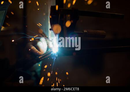 Welding work. High temperature. Hot steel. Metal welding. Production ...
