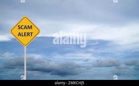scam - yellow sign with cloudy sky Stock Photo - Alamy