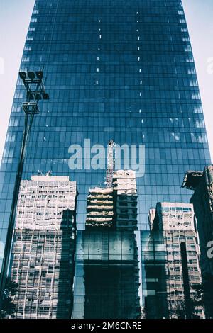 Tall corporate tower made of glass windows Stock Photo - Alamy