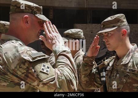 Lt. Col. Gregory Polk, the Task Force Pioneer commander, salutes a U.S ...