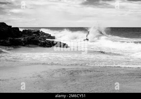 Beating the rock sea wave. Surf, waves, extreme sports Stock Photo - Alamy
