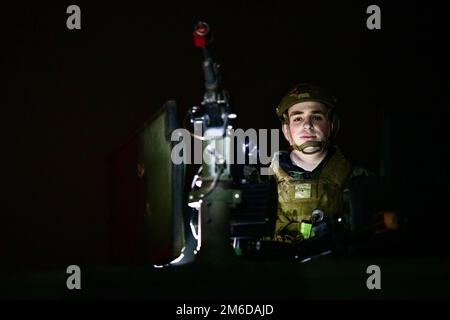 An 8th Security Forces Squadron defender patrols from a Humvee during a ...