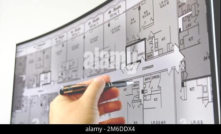 Blueprint monitor of a hand with pen explain plan of a van vehicle on ...