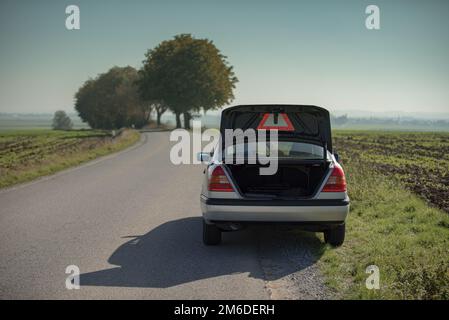 Old car with breakdown on country road Stock Photo - Alamy