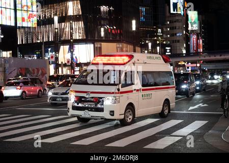 Ambulance responding to an emergency in Tokyo Japan at night Stock ...