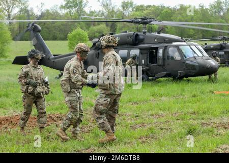 FORSCOM Command Sgt. Maj. Todd Sims talks with Roland Butler, a First ...