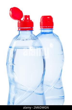 close up view of bottles of water and fresh juices in refrigerator ...