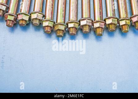 Copy space image Anchor bolts for concrete walls and nuts on metallic ...