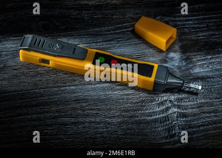 Electric tester on vintage wooden board Stock Photo - Alamy