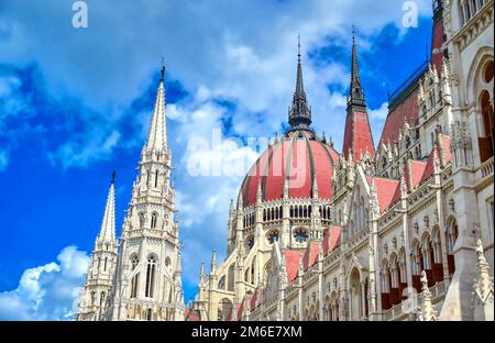 The Hungarian Parliament Building located on the Danube River in Budapest Hungary at sunset ...