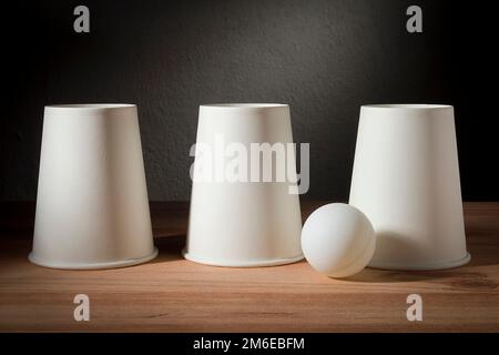 Disposable cups and ping pong ball Stock Photo - Alamy